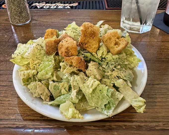 Even the Caesar salad knows its role here&mdash;a crisp, refreshing prelude to the main event, not trying to steal the spotlight.