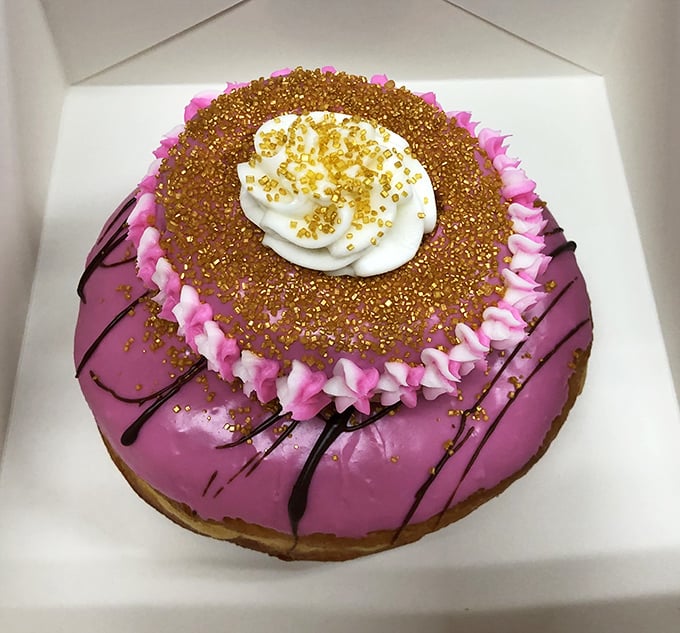 This isn't just a pretty pink donut&mdash;it's edible art with gold accents. Like a Florida sunset captured in fried dough and sweet glaze.