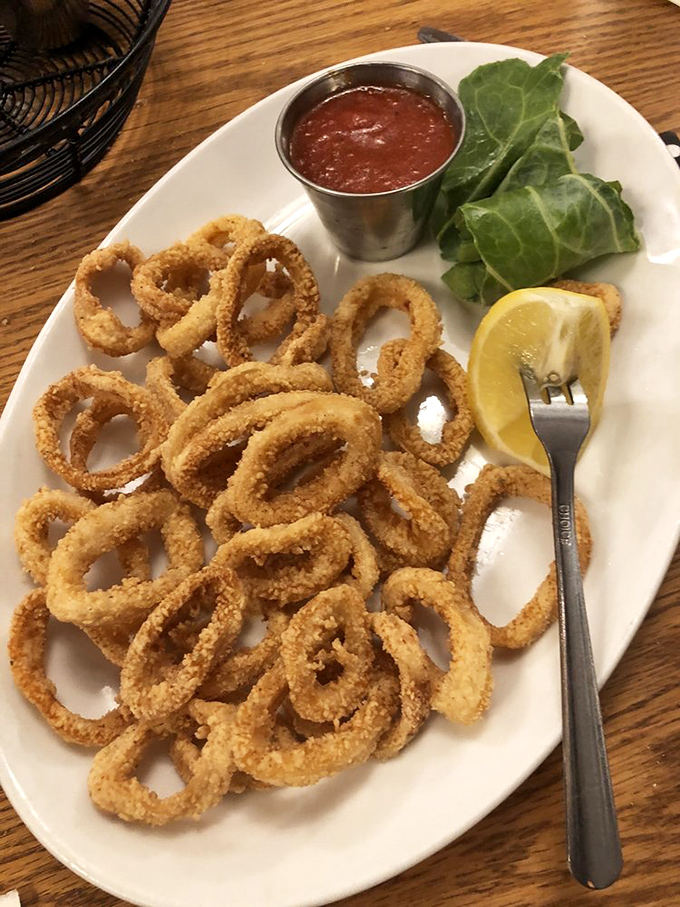 These golden calamari rings aren't just appetizers&mdash;they're crispy halos of deliciousness that make waiting for your steak a pleasure rather than a chore.
