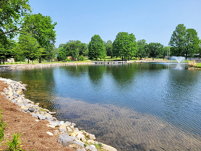 Capaha Park's serene lake offers an urban oasis where families gather, ducks paddle, and the fountain creates a soothing soundtrack to lazy afternoons.