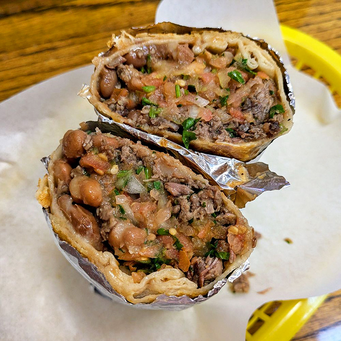 The carne asada burrito, sliced to reveal its inner glory. Like a good novel, it's what's inside that counts&mdash;beans, meat, and fresh ingredients in perfect harmony.