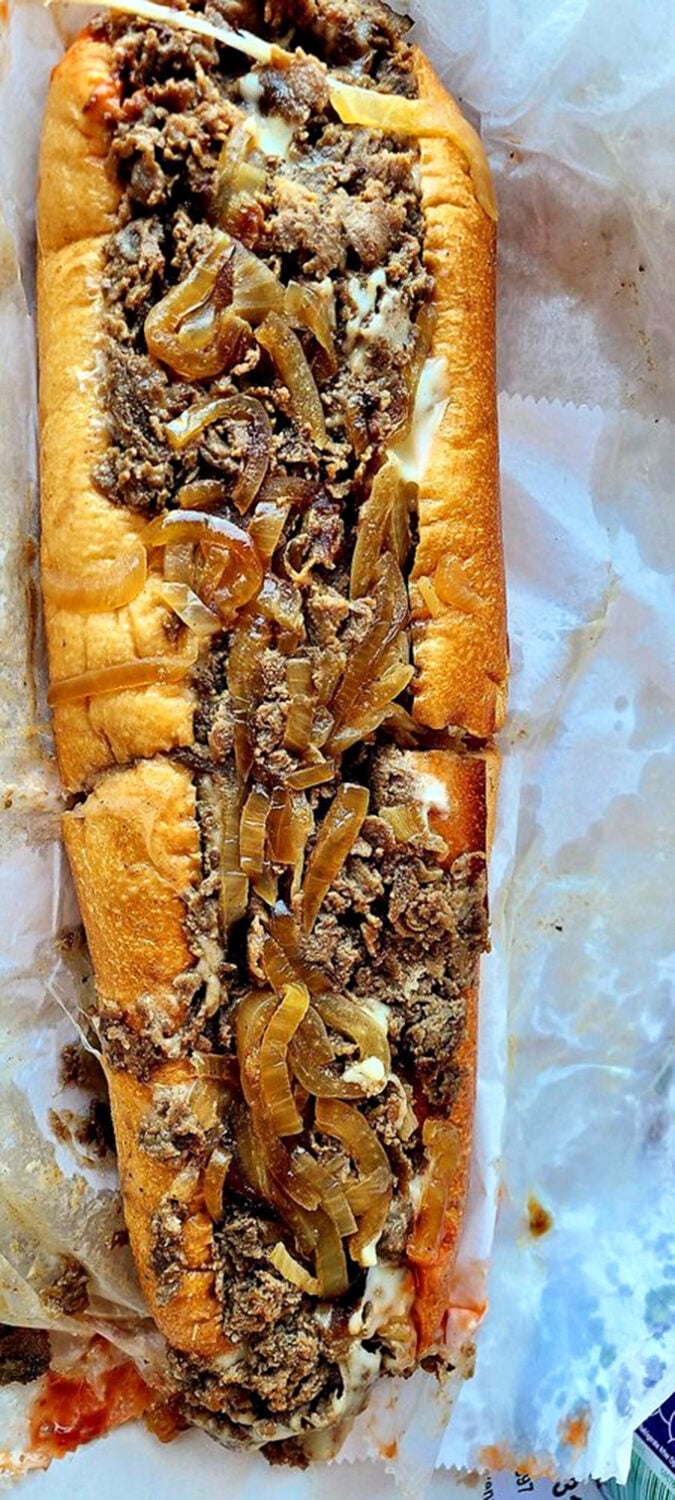 This cheesesteak isn't just a sandwich; it's a masterpiece of meat and melted cheese that makes you question why you'd eat anything else.