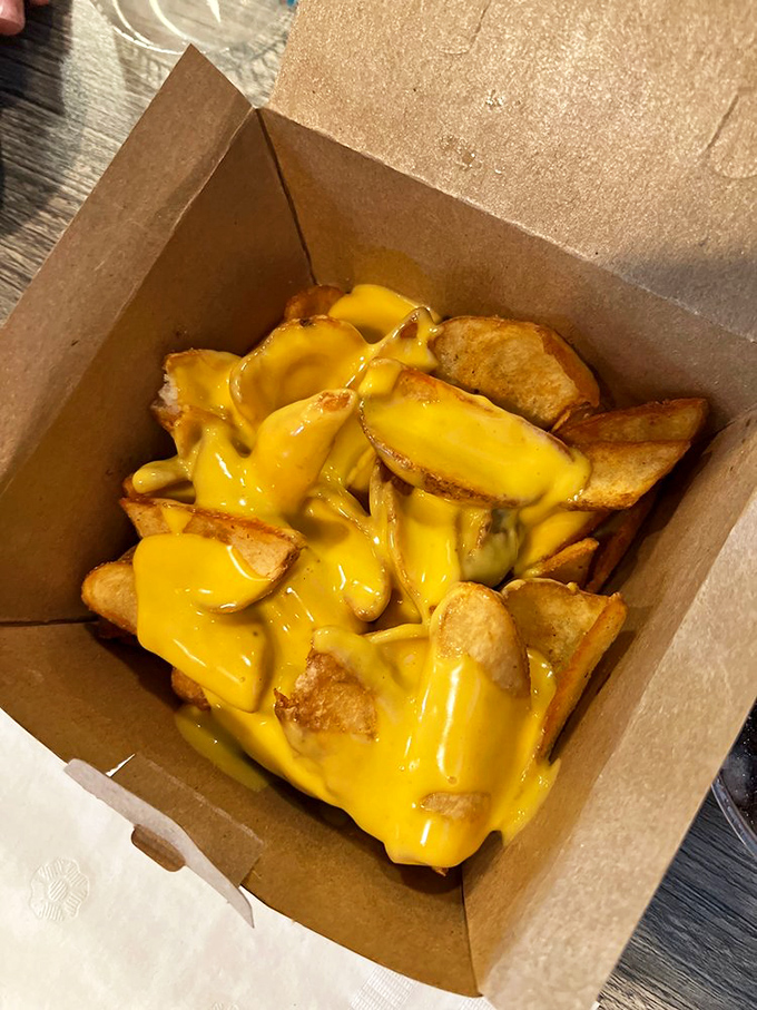 These cheese fries aren't just a side dish&mdash;they're a religious experience. That molten yellow goodness demands both reverence and napkins.