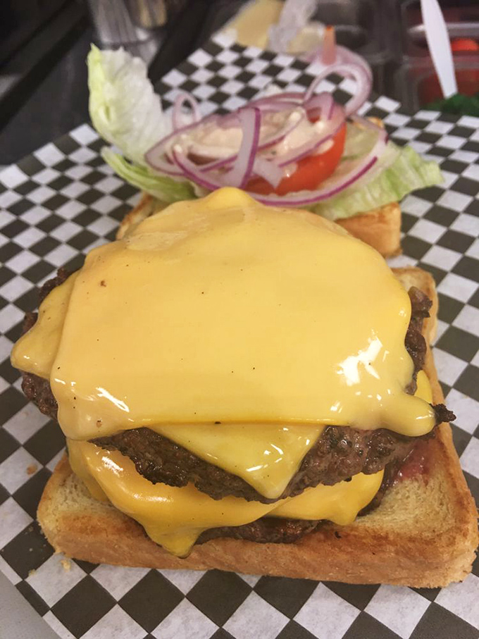 A cheeseburger so perfectly melty it should come with a warning label: "May cause spontaneous sighs of contentment."