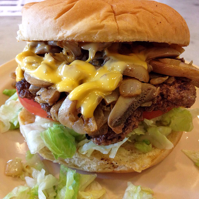 Mushroom and cheese cascade like delicious lava over this burger masterpiece&mdash;proof that sometimes more is exactly the right amount.