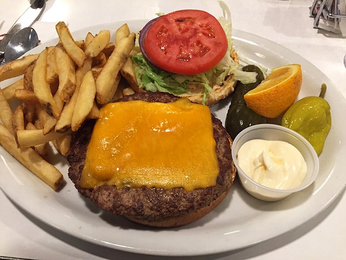 The cheeseburger arrives like a beautiful, edible monument to simplicity &ndash; perfectly melted cheese cascading down a juicy patty with crispy fries standing guard.