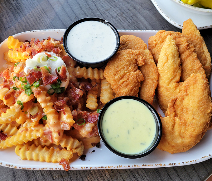 The holy trinity of comfort food: golden chicken tenders, perfectly crisp fries, and not one but TWO dipping sauces. This plate doesn't judge your inner child.
