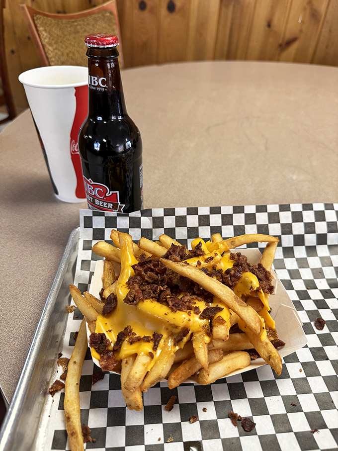 Cheese fries with bacon bits&mdash;because sometimes the best things in life are the messiest. Worth every napkin. 