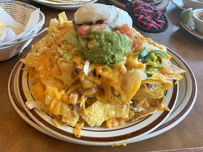 Cheese pulls for days! This nacho platter has more layers than your favorite telenovela and twice the drama.