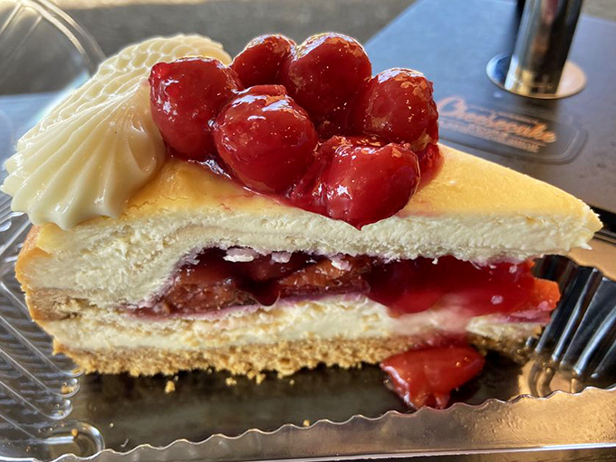 Cherry cheesecake that makes you question every other dessert relationship you've ever had. Those glistening berries aren't just toppings—they're jewels.