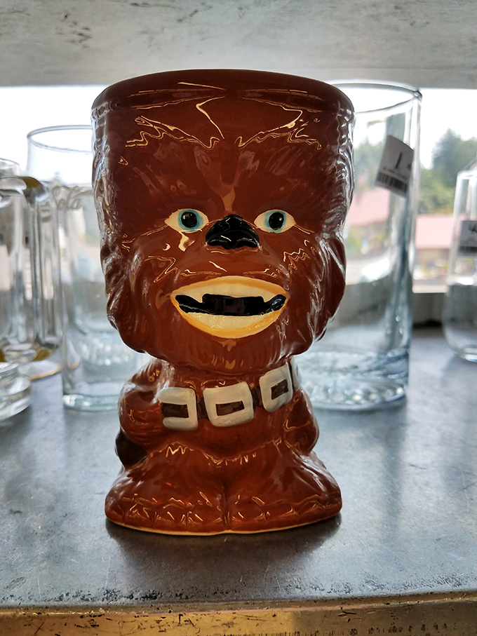 "Help me, thrifty shopper, you're my only hope!" This Chewbacca mug waits patiently among ordinary glassware for a Star Wars fan to rescue it.