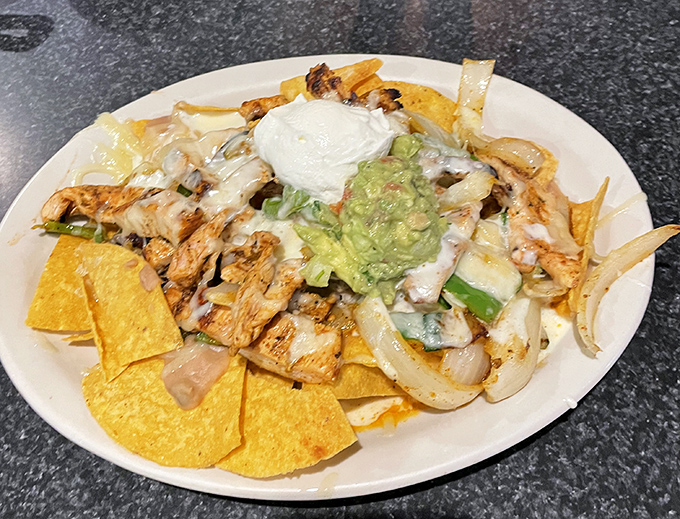 Chicken fajita nachos that make sharing optional. That melty cheese pull should qualify as performance art.