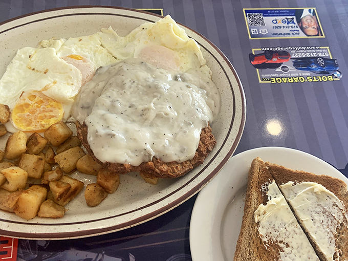 This isn't just Chicken Fried Steak&mdash;it's therapy on a plate. The golden-brown masterpiece under river of gravy alongside perfectly cooked eggs and home fries demands a moment of silence.
