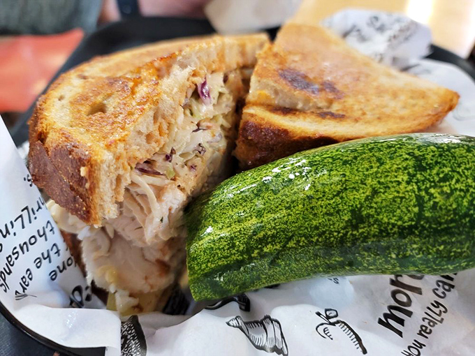 The Chicken Reuben offers a lighter twist on the classic, proving that poultry can party just as hard as corned beef when given the chance.