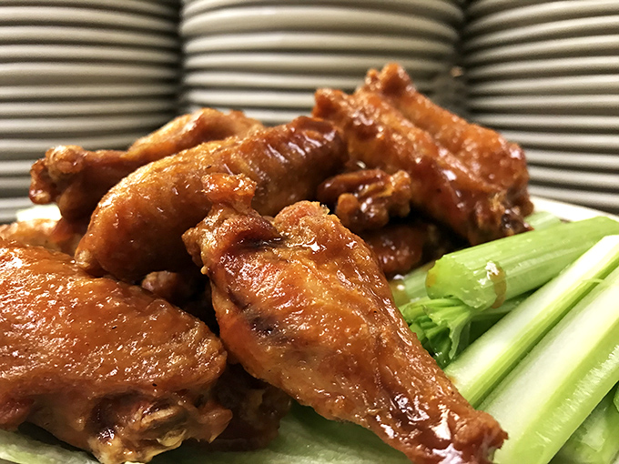 Wings that don't need a sporting event excuse to be enjoyed. Crispy, saucy, and served with the mandatory celery sticks for the illusion of healthiness.