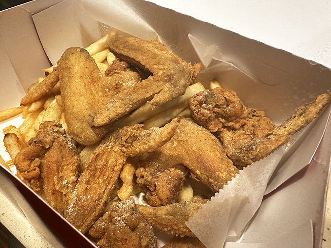 Wings and fries nestled together in their paper home&mdash;a marriage of crispy delights that's lasted longer than most Hollywood relationships.