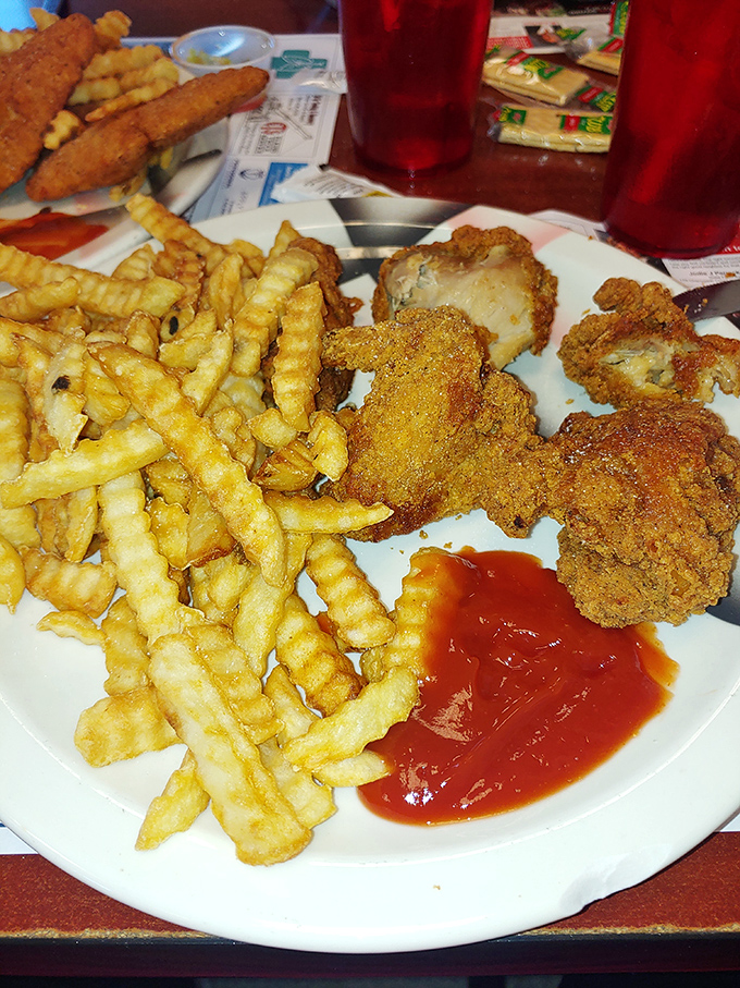 Comfort food nirvana! Crispy chicken meets those legendary fries in a plate that says, "Diet? What diet? This is worth every delicious calorie."