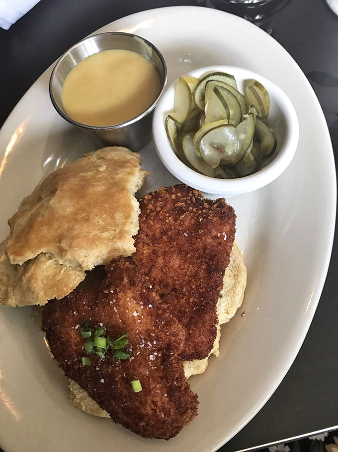 The chicken biscuit sandwich: where Southern comfort meets New England ingenuity. Those house-made pickles cut through the richness like a well-timed punchline.