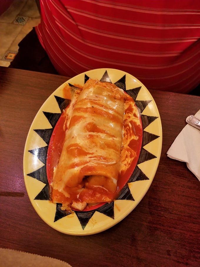 Behold the chicken burrito in its natural habitat &ndash; swimming in sauce, melted cheese creating that Instagram-worthy cheese pull moment.