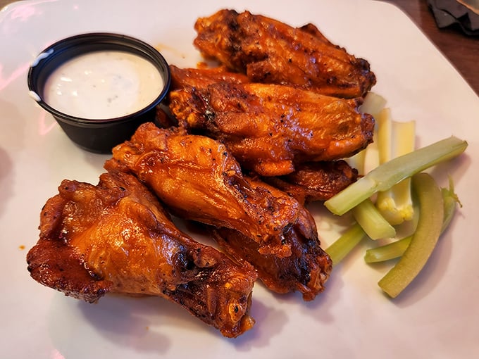 These wings aren't just cooked&mdash;they're persuaded to greatness. Crispy, saucy revelations served with cooling celery and creamy dip for balance.