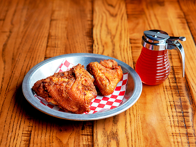 Fried chicken that makes Colonel Sanders look like an amateur. That honey drizzle? Pure genius that'll have you licking your fingers with zero shame.