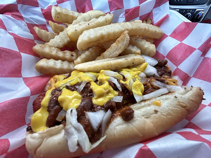 This chili dog isn't just food; it's an event. The mustard and onions play supporting roles to the star&mdash;that glorious, messy chili.
