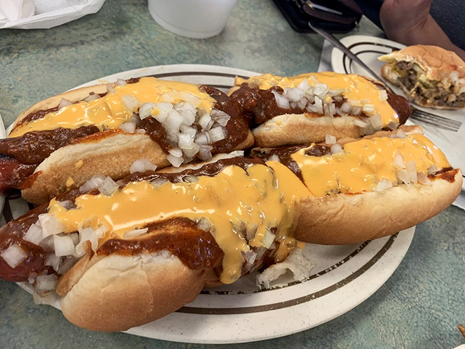 When chili meets cheese meets onions on a hot dog, magic happens and your taste buds throw a parade.