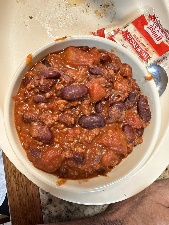 Chili that doesn't mess around – hearty, bean-studded, and meaty enough to make you consider ordering a second bowl for the road.