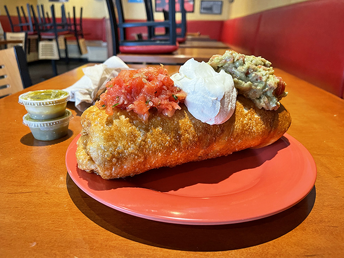The chimichanga: proof that sometimes the best things in life are deep-fried. This golden masterpiece wears its toppings like medals of honor.