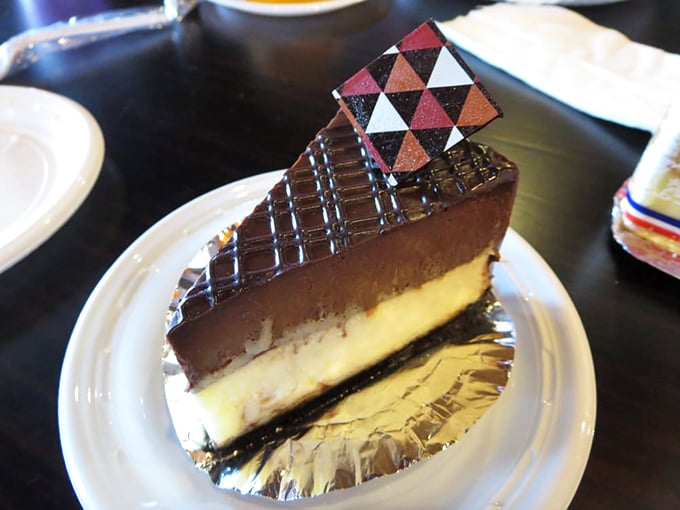 Layer upon layer of chocolate and vanilla cheesecake that makes you wonder if architects should be designing desserts instead of buildings.