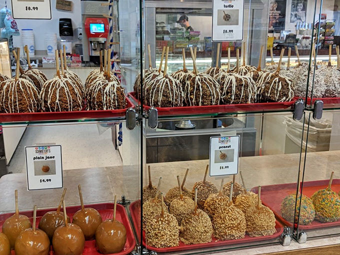 Caramel apples dressed in their formal chocolate attire, accessorized with nuts and toppings. Fruit never looked so gloriously guilty.