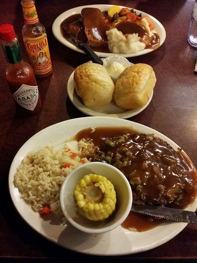 A table set for comfort food royalty: Mom's meatloaf with all the fixings, paired with fresh rolls that deserve their own fan club.