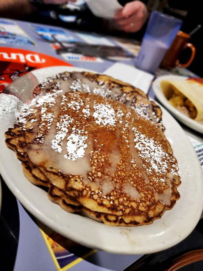 These pancakes don't just say good morning&mdash;they practically sing it. Cinnamon sweetness crowned with powdered sugar and drizzle.