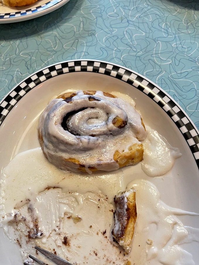 This isn't just any cinnamon roll&mdash;it's the reason elastic waistbands were invented. Swimming in icing that melts into every warm, cinnamon-spiced crevice.
