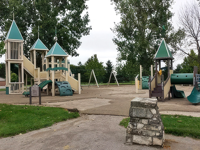 Playground equipment standing at attention, ready for tiny commanders to scale its towers and conquer its slides&mdash;childhood adventures in the heart of Delphos.
