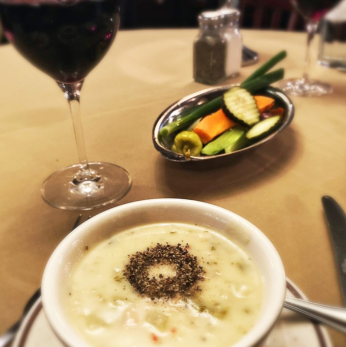 A bowl of creamy chowder that doesn't just warm your stomach but hugs your soul. The fresh vegetables alongside are the supporting cast.