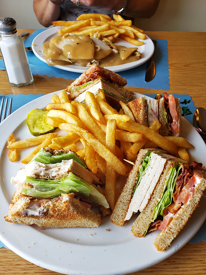 Club sandwiches stacked higher than your weekend to-do list, with crispy fries that could make a French chef jealous.