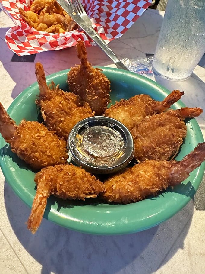 The legendary coconut shrimp &ndash; golden-brown perfection with a crunch you can hear across the restaurant. Worth driving across state lines for this tropical treasure.