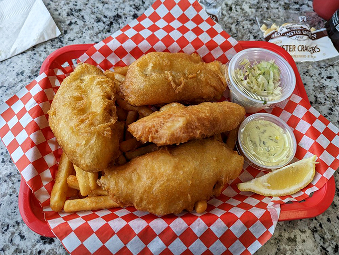 The platonic ideal of fish and chips&mdash;cod wearing a crispy golden jacket, accompanied by fries that deserve their own fan club.