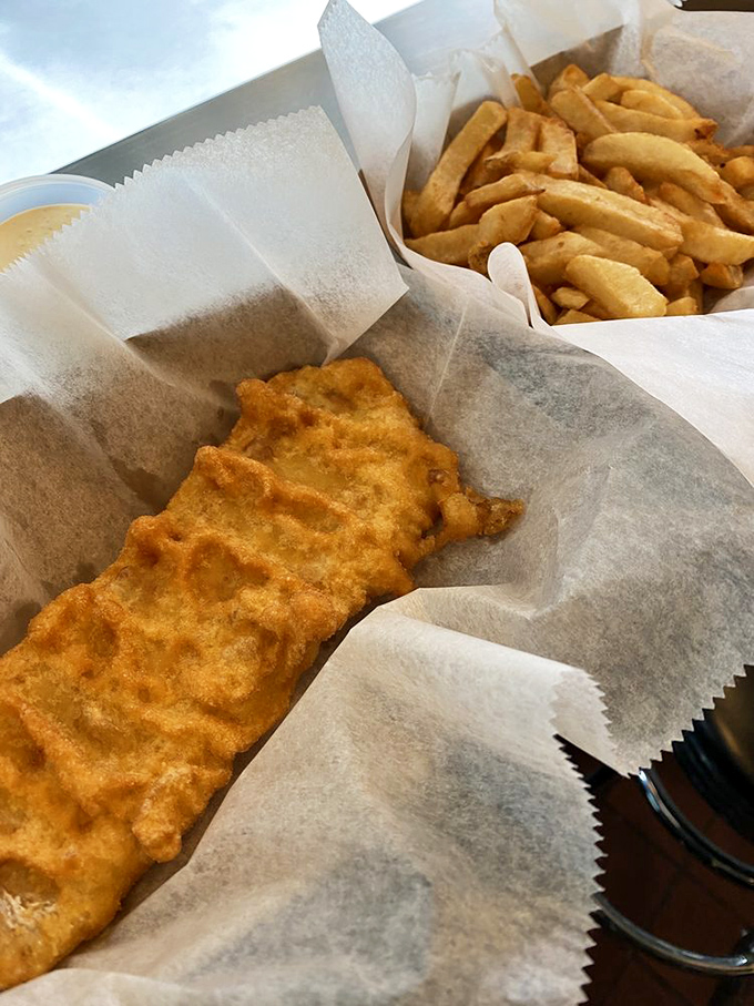 Crispy on the outside, tender heaven within. This perfectly fried cod and golden chips demonstrate why sometimes the simplest foods are the hardest to perfect.