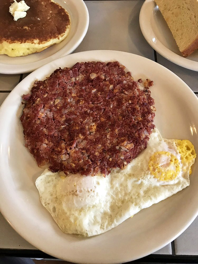 The perfect marriage: crispy corned beef hash meets sunny-side-up eggs. Like breakfast's version of Bogart and Bacall.