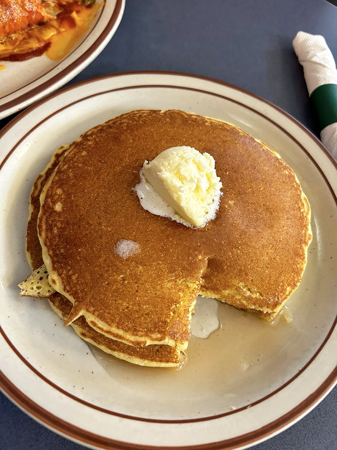 This perfect pancake with its crispy edges and fluffy center has clearly earned its doctorate in breakfast satisfaction.