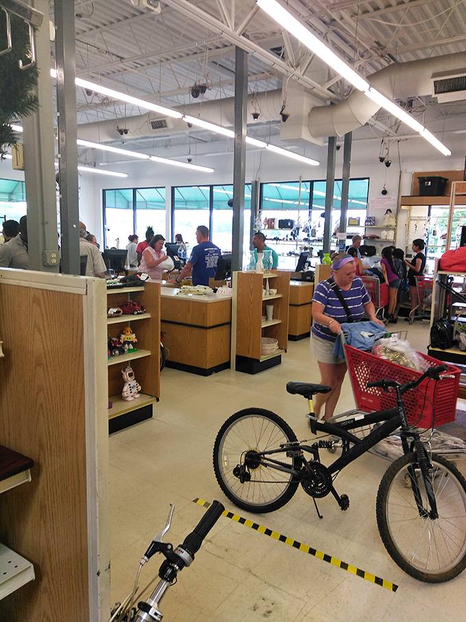 Where shoppers gather to transform their findings into treasures. The checkout area buzzes with the excitement of successful hunts.