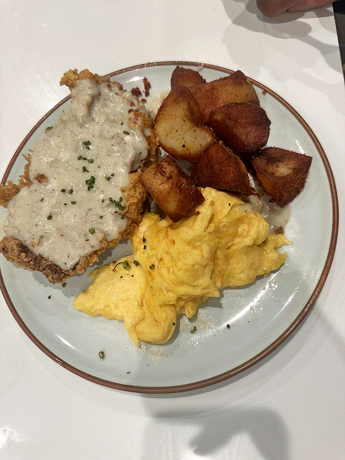 Country fried steak with creamy gravy, fluffy eggs, and crispy potatoes&mdash;the holy trinity of breakfast that turns morning grumps into grateful humans.
