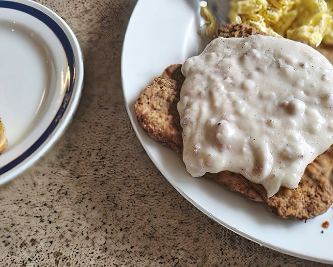This isn't just country fried steak&mdash;it's a masterclass in comfort, with crisp breading yielding to tender meat under a blanket of velvety gravy.