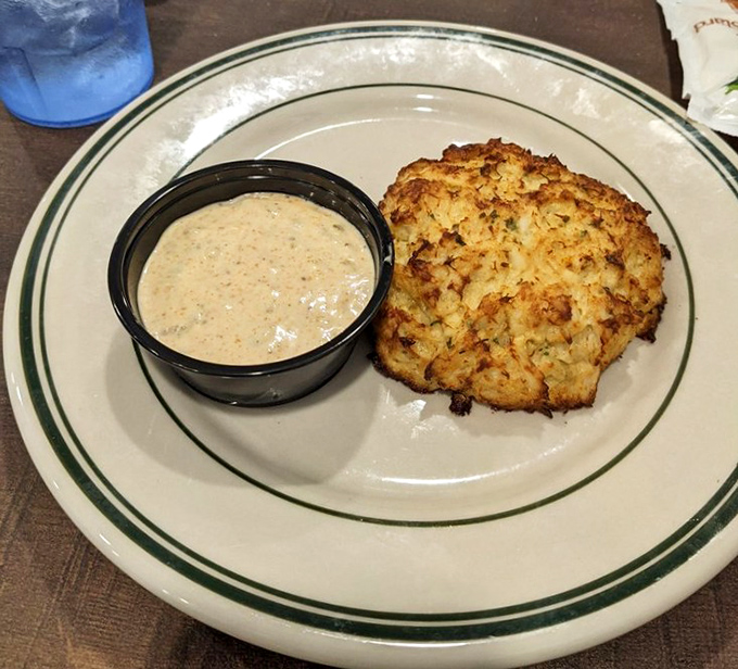 This golden-brown crab cake isn't trying to reinvent the wheel&mdash;it's just executing it flawlessly. The accompanying sauce adds a tangy counterpoint to the sweet crab.