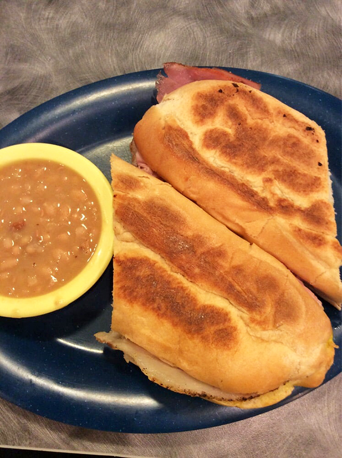 A sandwich that bridges cultures and satisfies souls. Golden-pressed Cuban with a side of beans that clearly simmered all day while telling stories.
