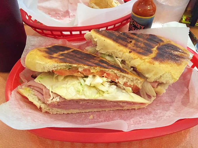 The Cuban sandwich: architectural perfection between bread. Each layer plays its part in a symphony of ham, pork, cheese, and pickles that Mozart would envy.