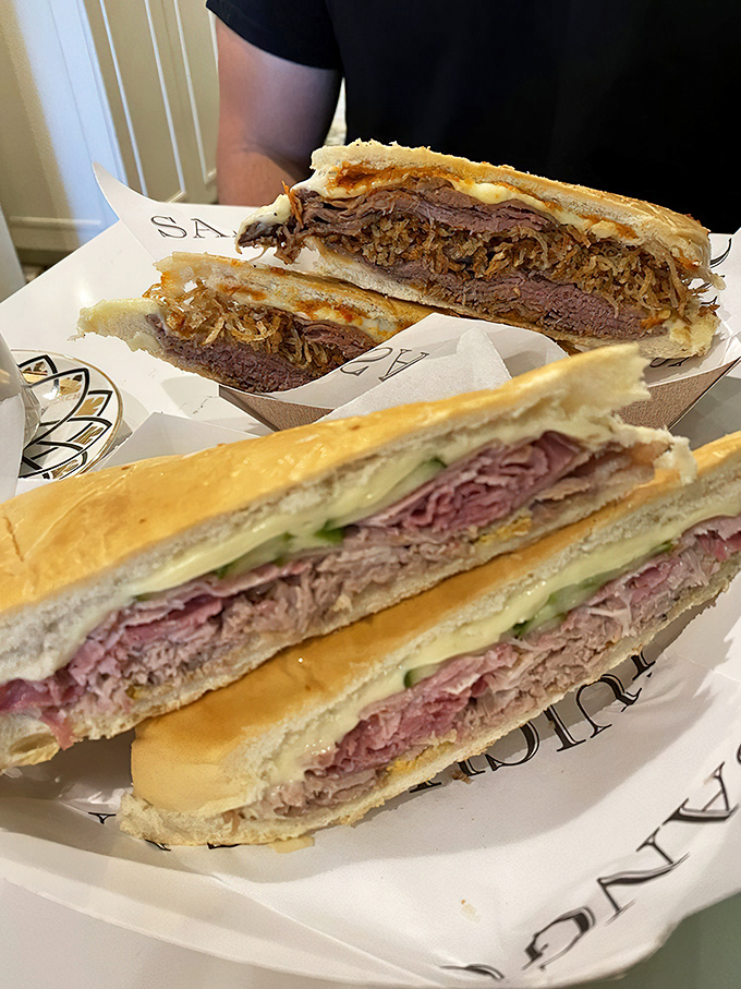 Behold the cross-section of perfection &ndash; layers of meat, cheese, and pickles pressed between bread that's achieved crispy-outside, soft-inside harmony.