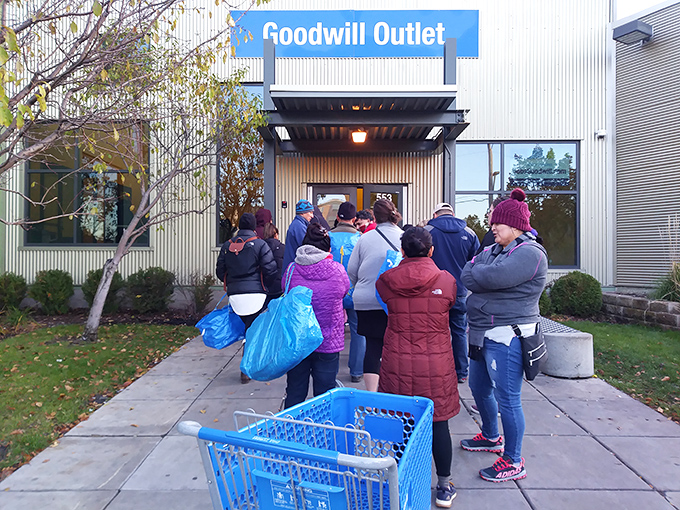 The pre-opening ritual where dedicated bargain hunters gather with the focus of Olympic athletes awaiting the starting gun.